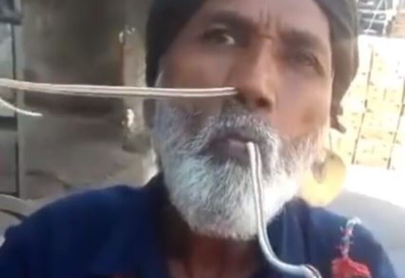 This person put the snake in the nose and took it out of the mouth, the ...